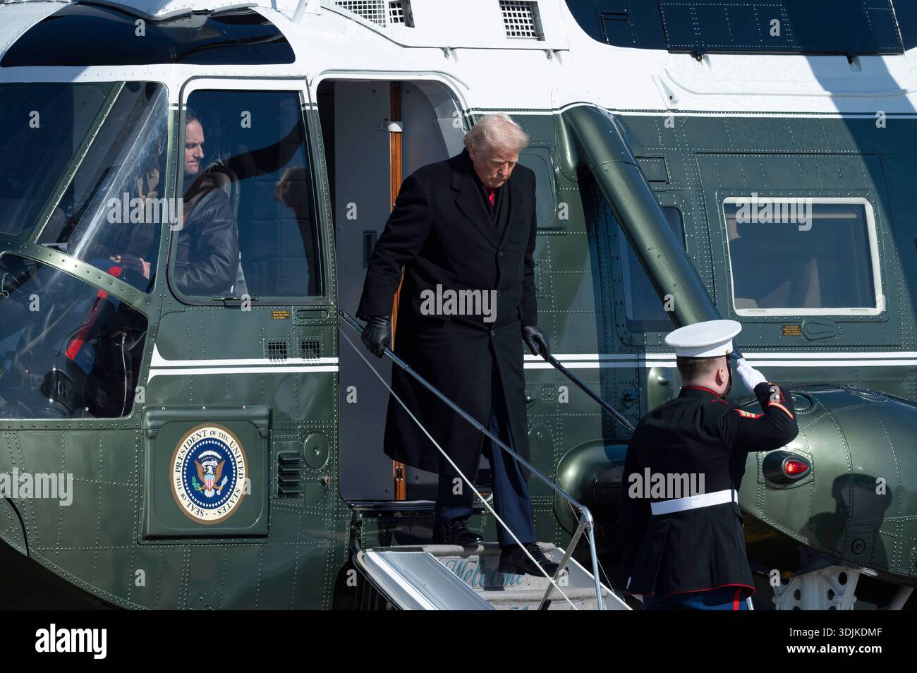 The Marine One pilot watches as President Donald Trump exits the ...