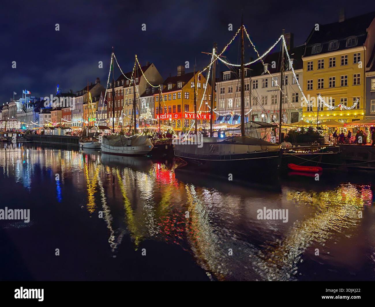 Copenhagen, Denmark - December 19, 2025: Nyhavn canal with string ...