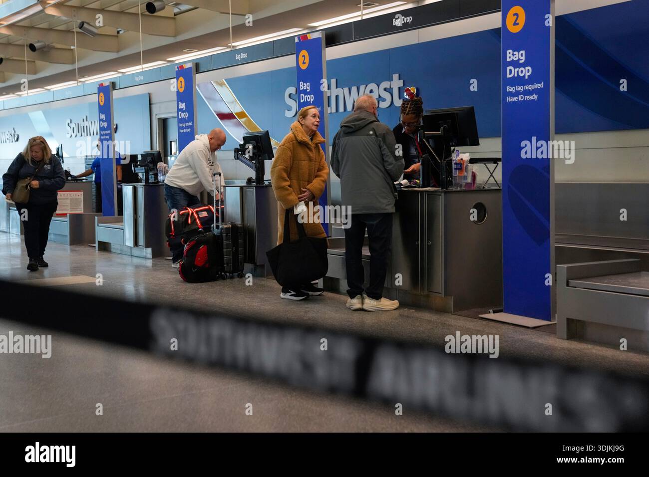 Travelers check in with Southwest Airlines at Midway International ...