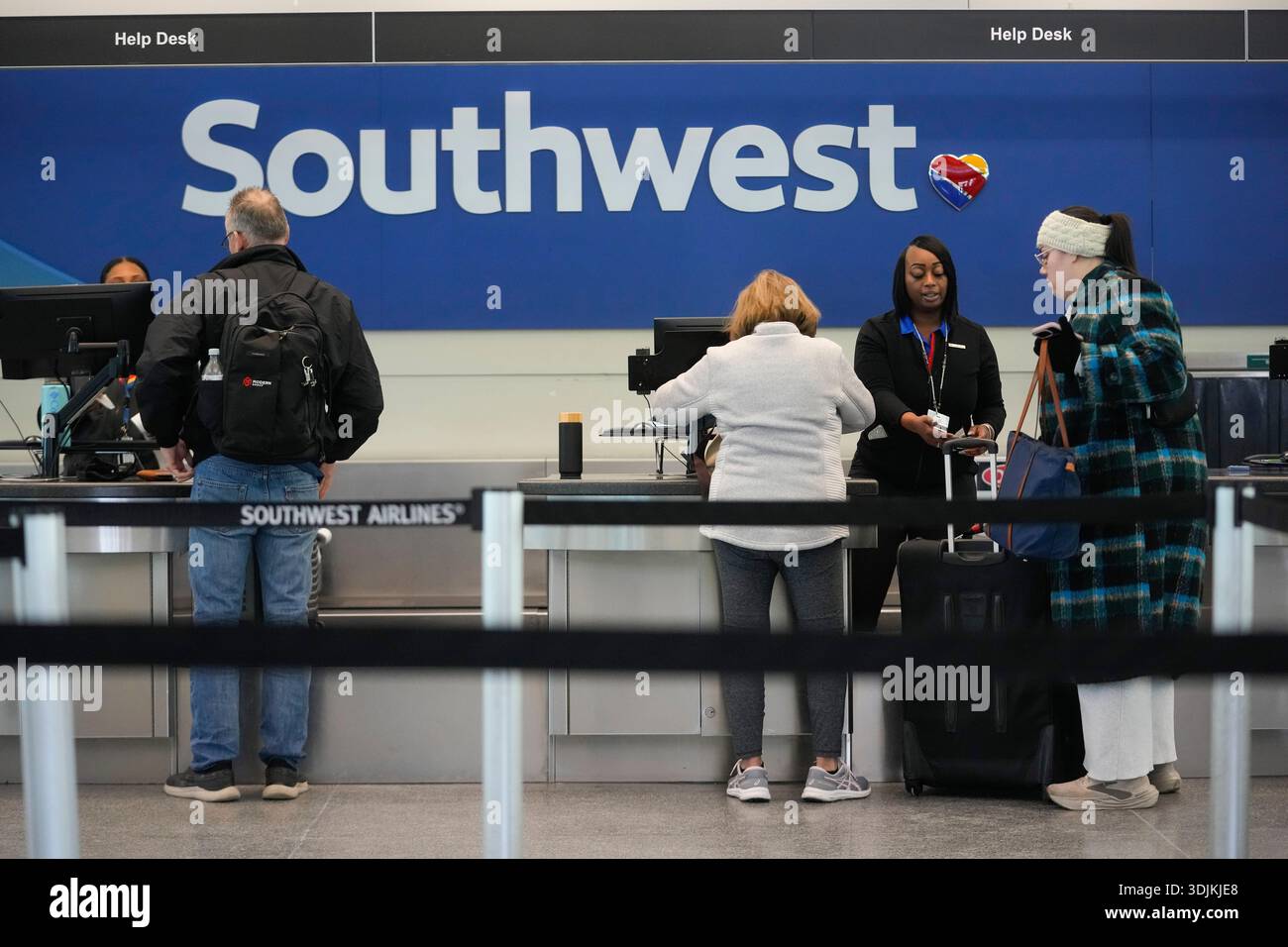 Travelers check in with Southwest Airlines at Midway International ...