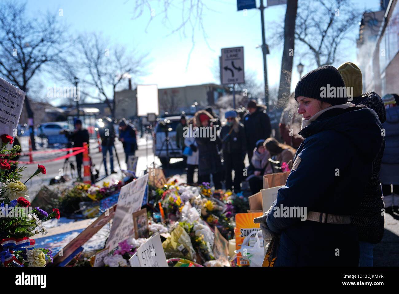 People visit a memorial for Alex Pretti at the scene where the 37-year ...
