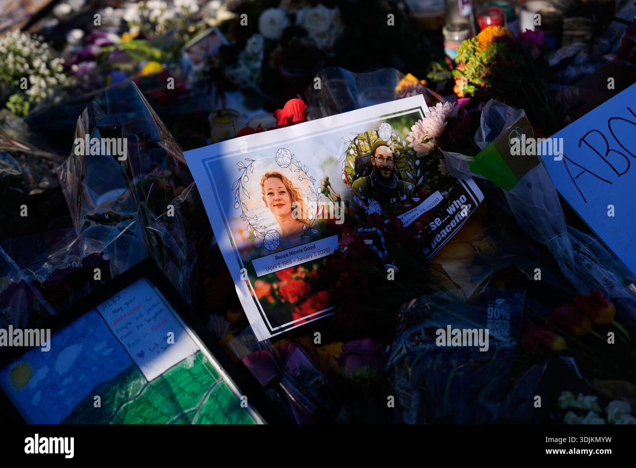 Photos of Renee Good and Alex Pretti are displayed at the scene where ...