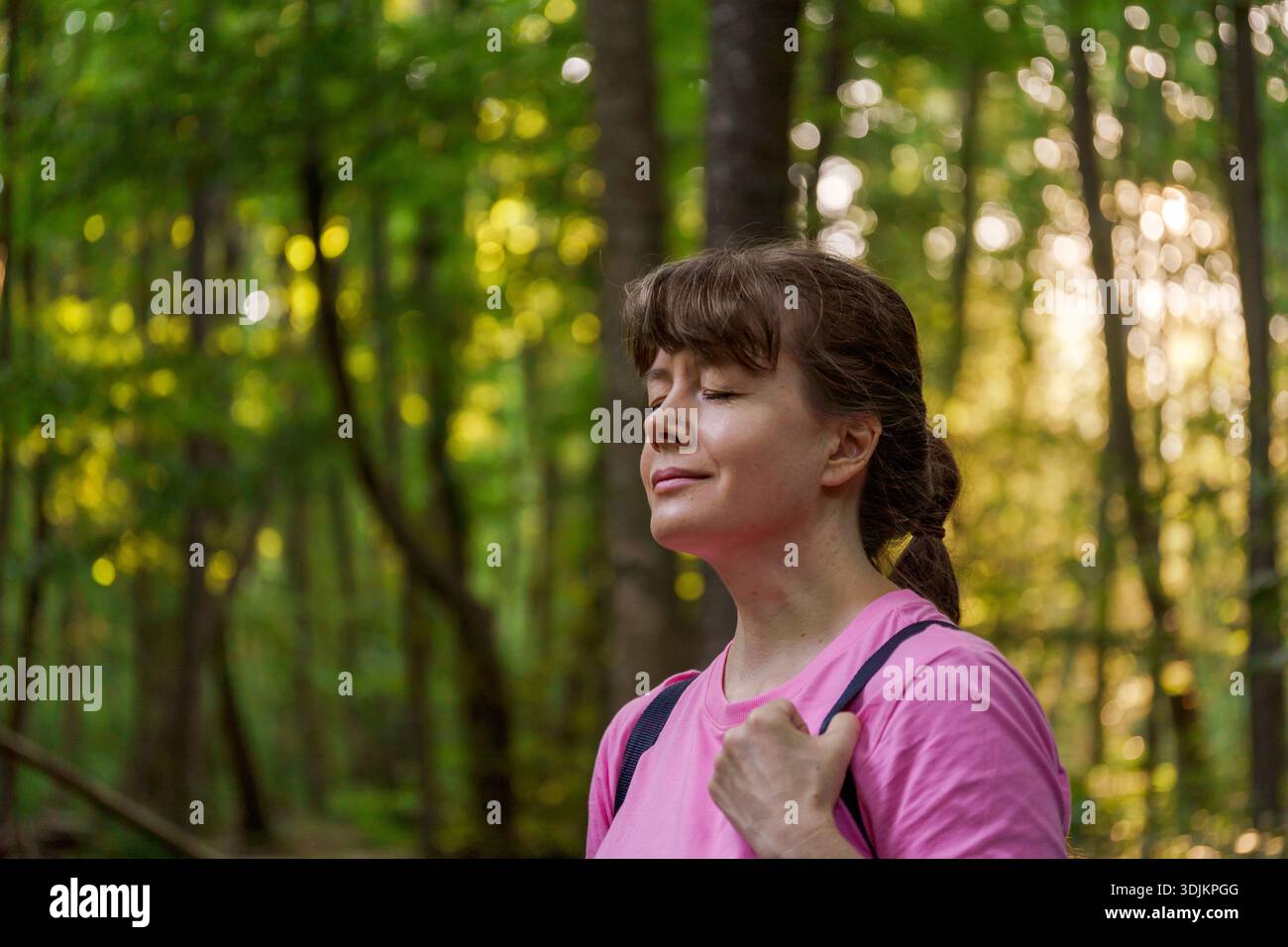 Woman calmly standing eyes closed hi-res stock photography and images ...