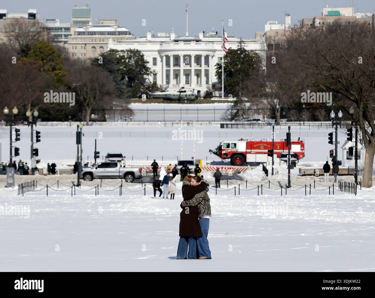 Two women hug each other on the National Mall near the White House ...