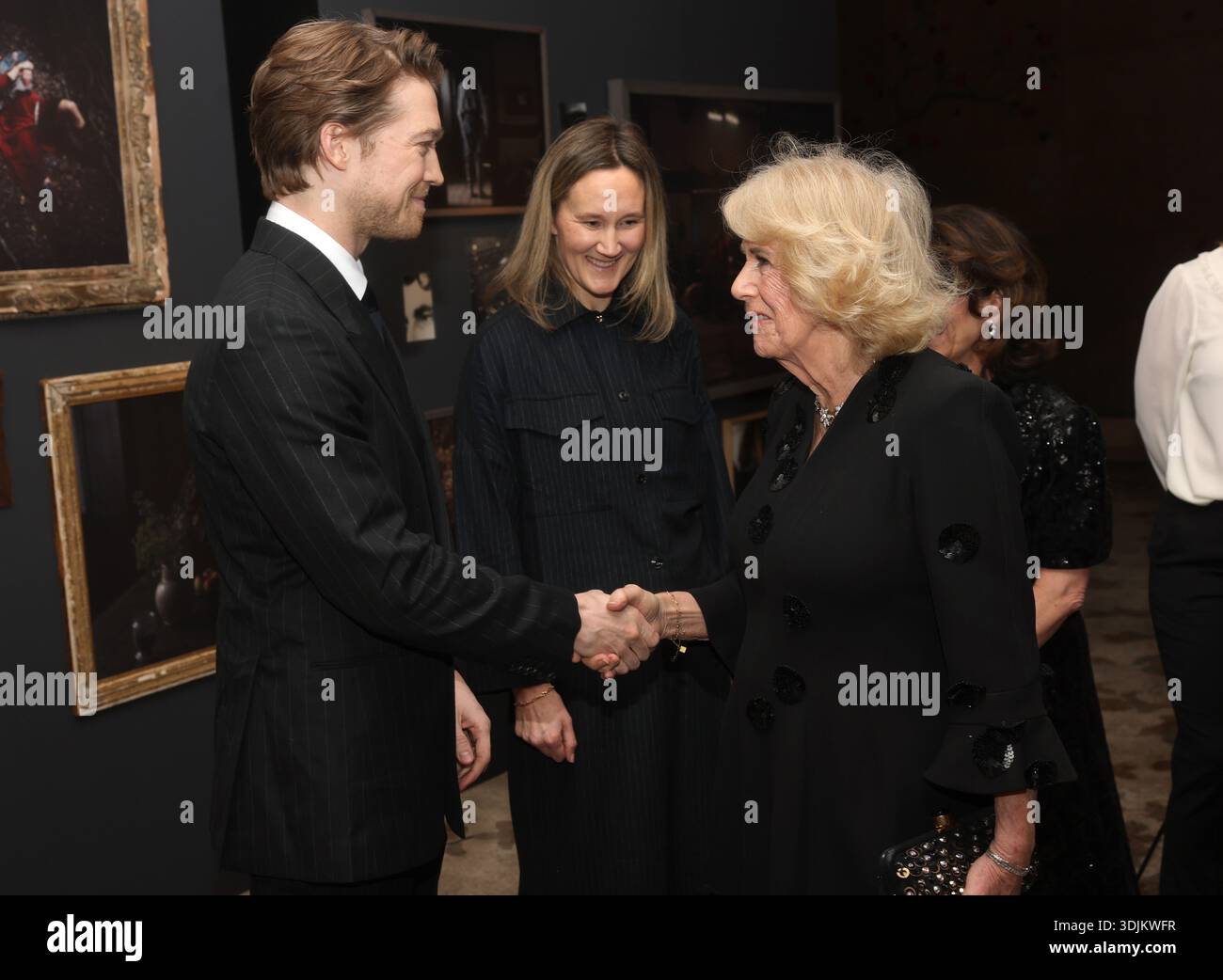 Queen Camilla meeting Joe Alwyn and Alice Felton as she attends a ...