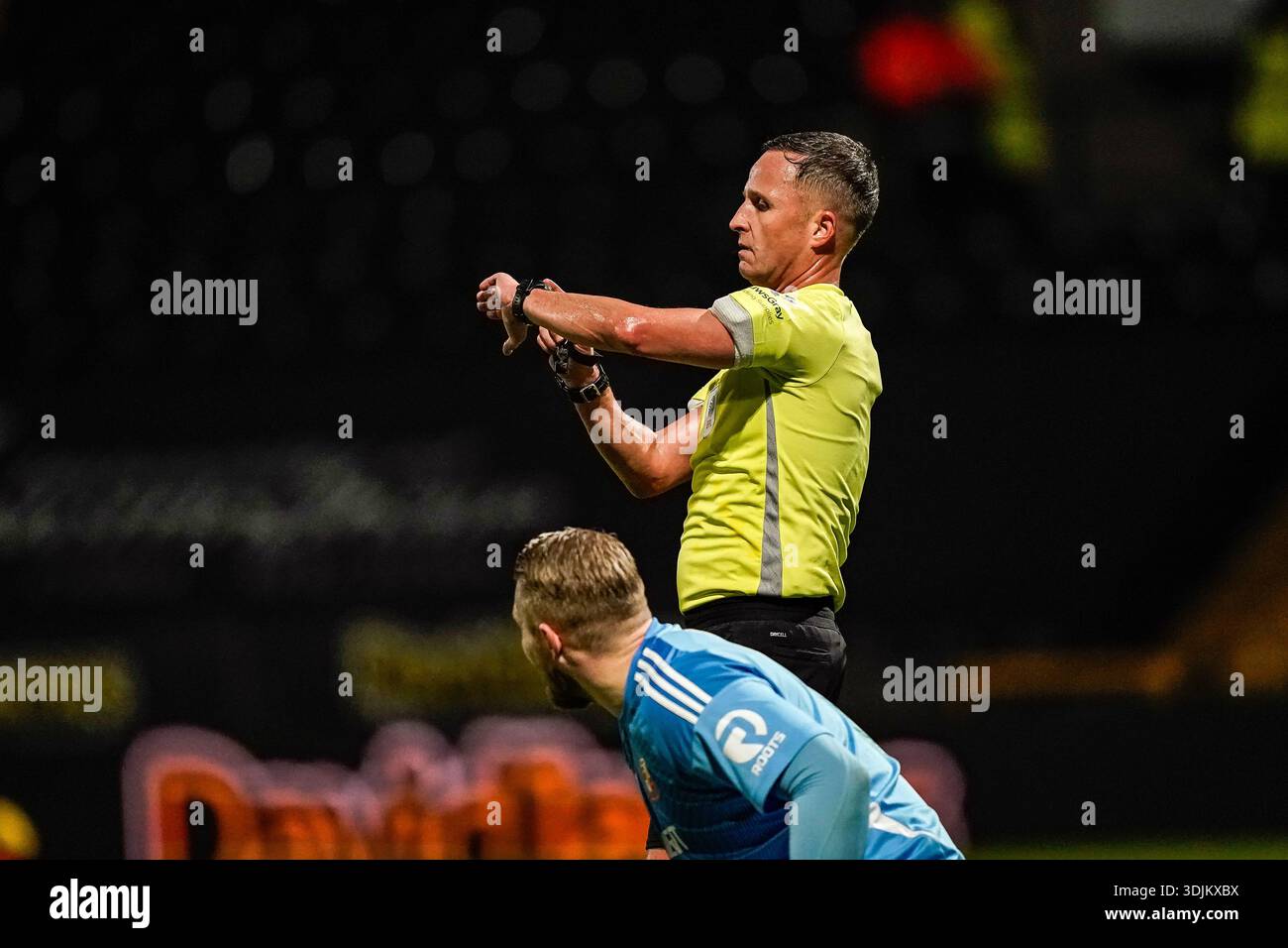 Referee David Webb signals to his watch after Connor Ripley of Swindon ...