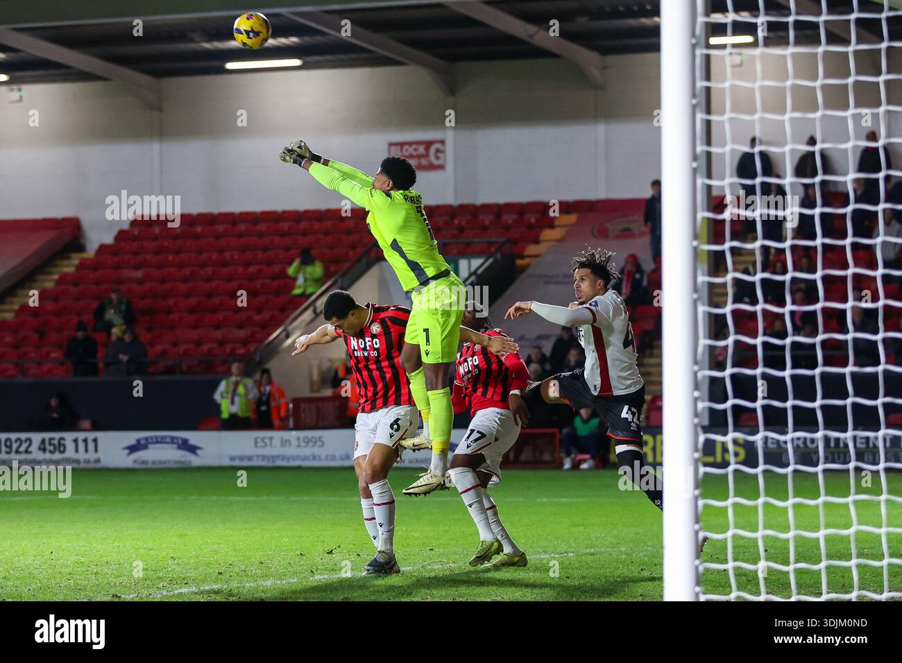 1, Myles Roberts of Walsall FC punches the ball away during the Sky Bet ...