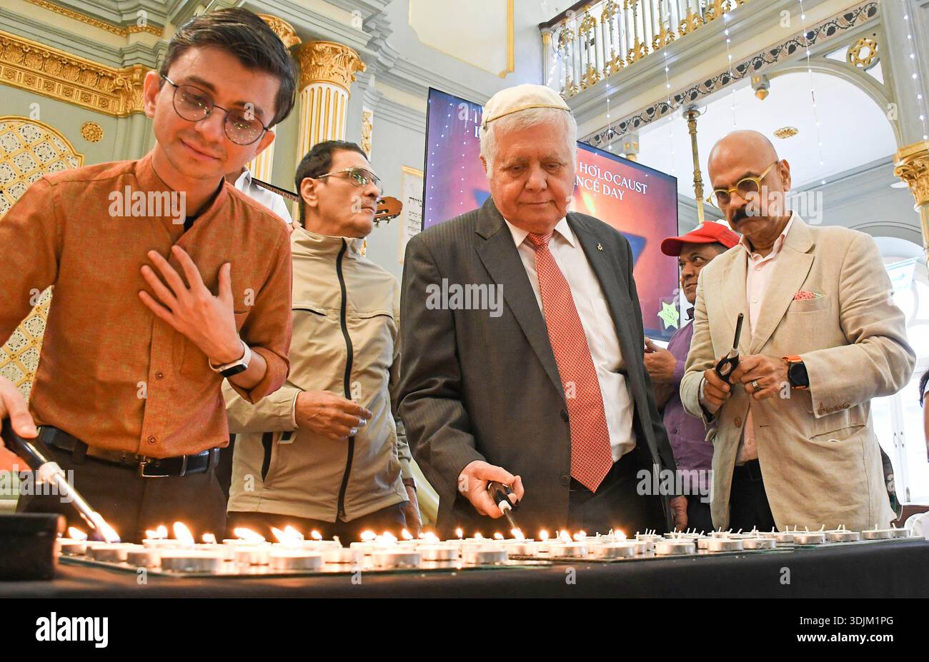 Members of Jewish community light candles at Keneseth Eliyahoo ...