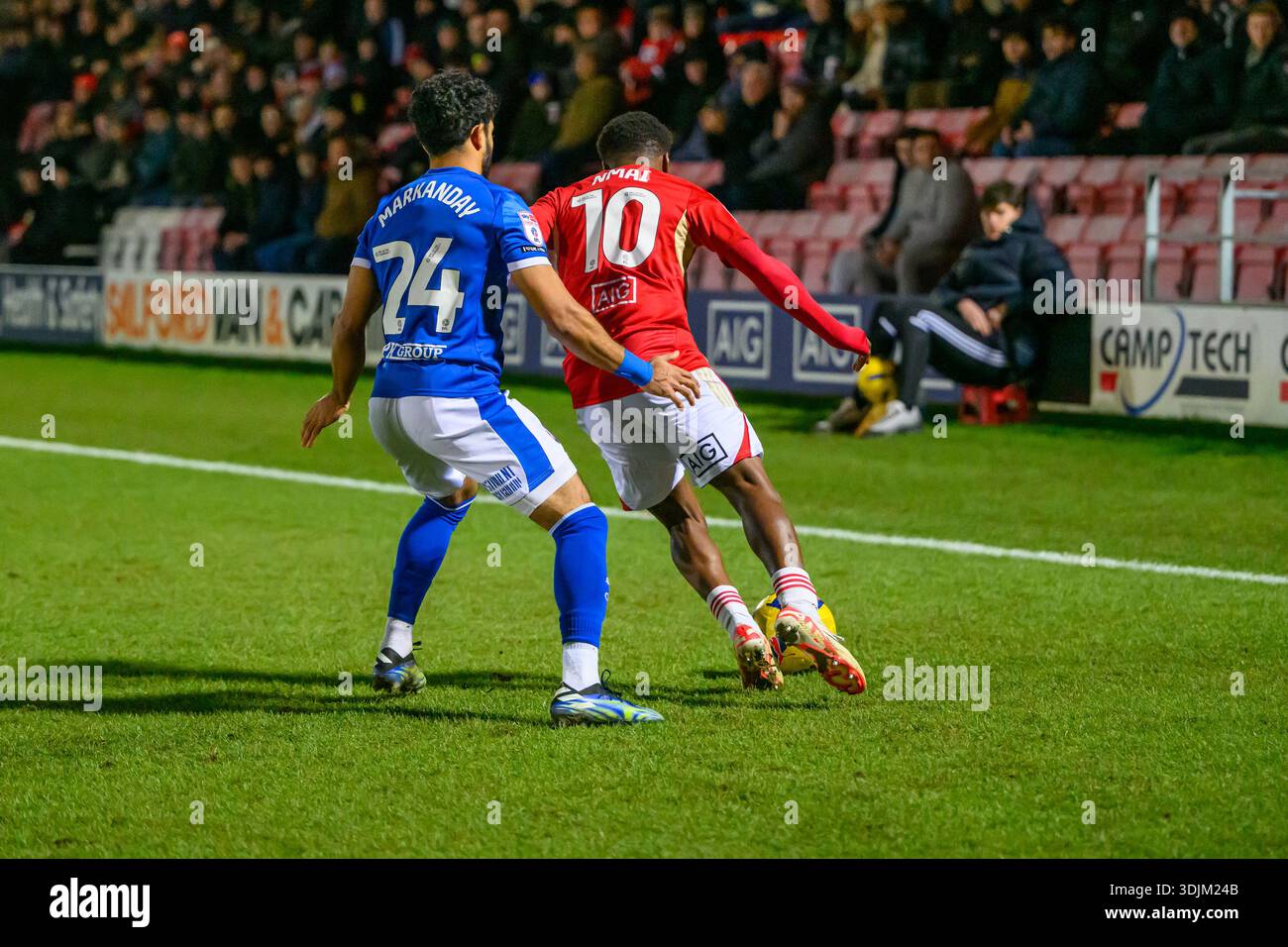 Dilan Markanday of Chesterfield FC tackles Kelly Nmai of Salford City ...