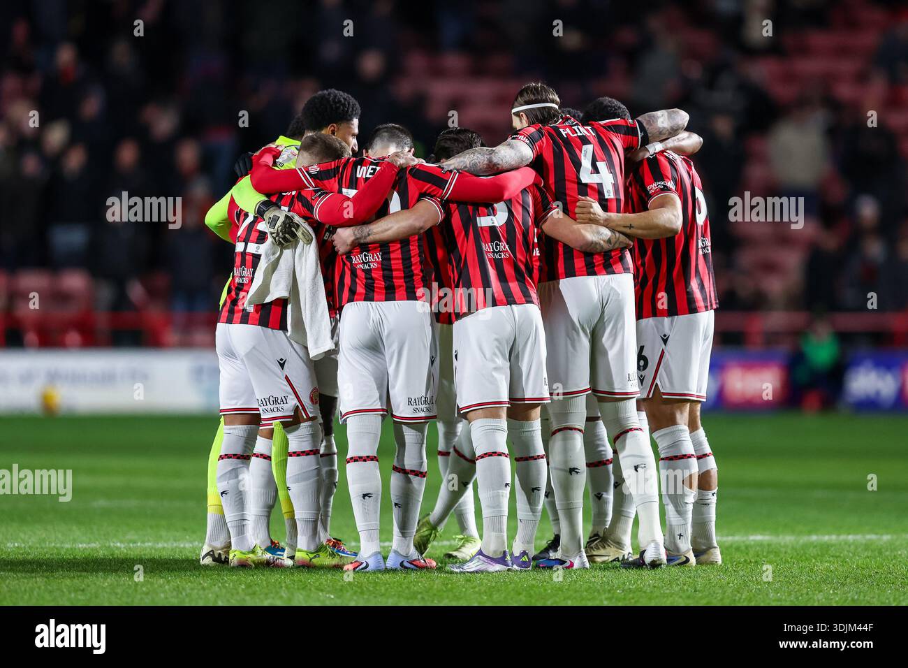 Walsall FC starting Xl team huddle at kick off during the Sky Bet ...