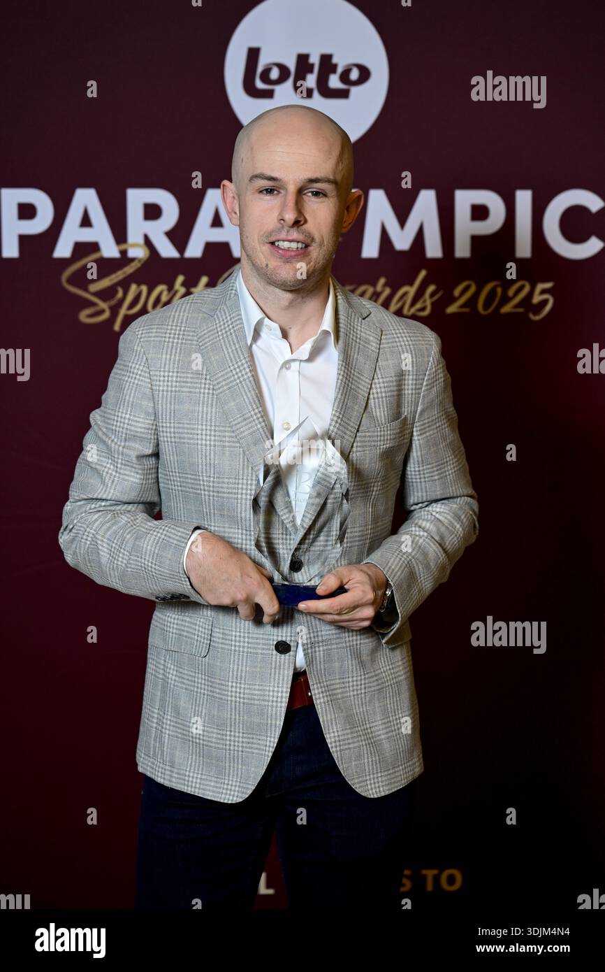 Sportsman of the Year winner Tim Celen poses with his trophy at the ...
