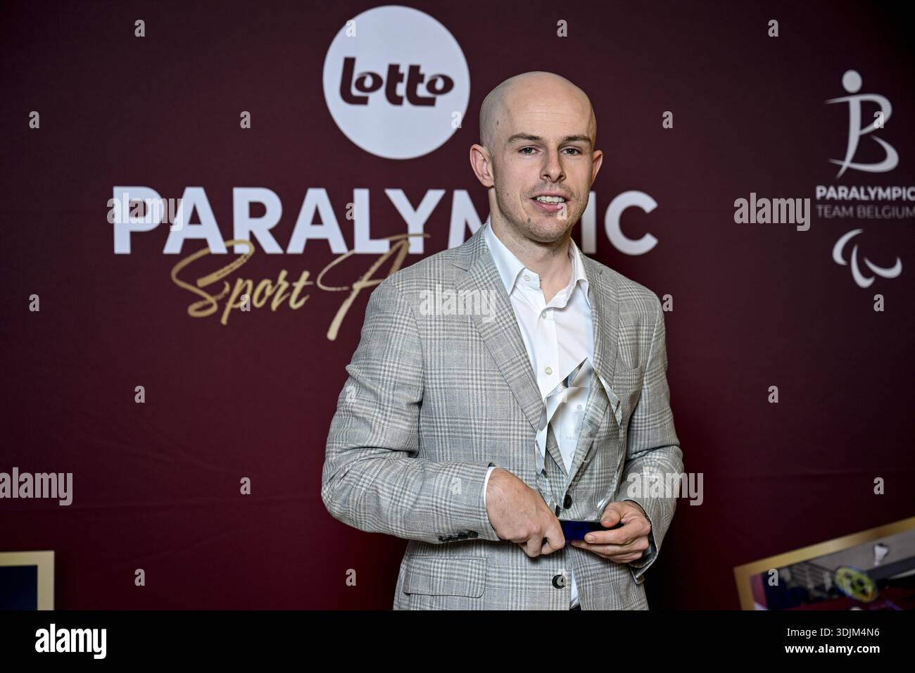 Sportsman of the Year winner Tim Celen poses with his trophy at the ...