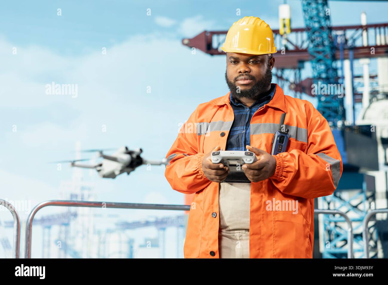 Drilling rig technician using drone to access areas that pose ...