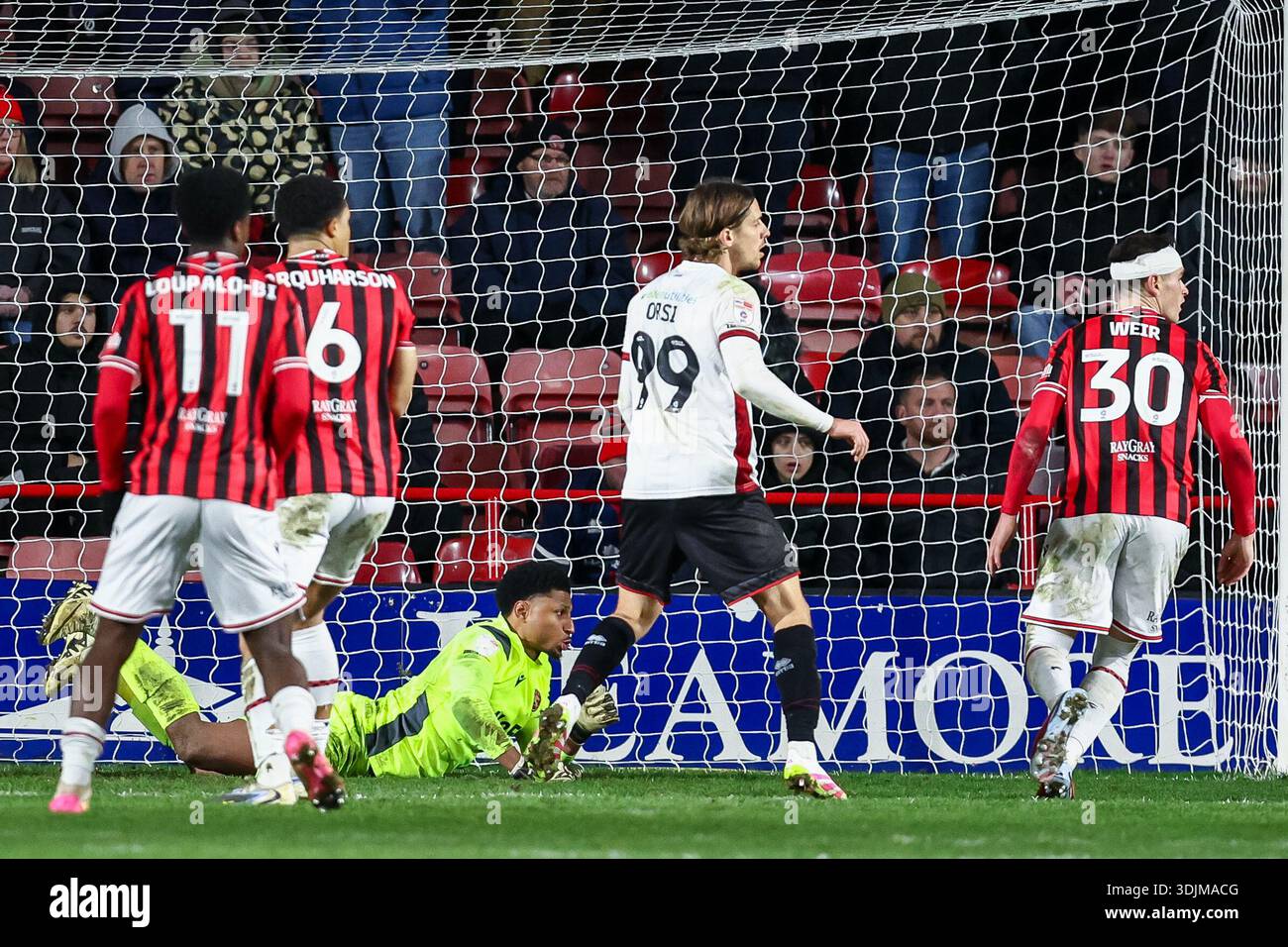 1, Myles Roberts of Walsall FC sprawls as he makes the save during the ...