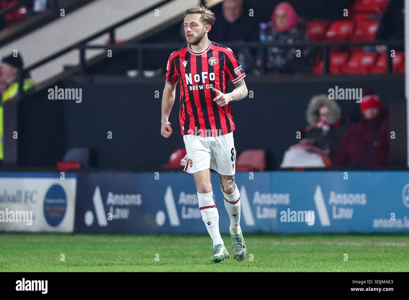 8, Charlie Lakin of Walsall FC moves forward during the Sky Bet League ...