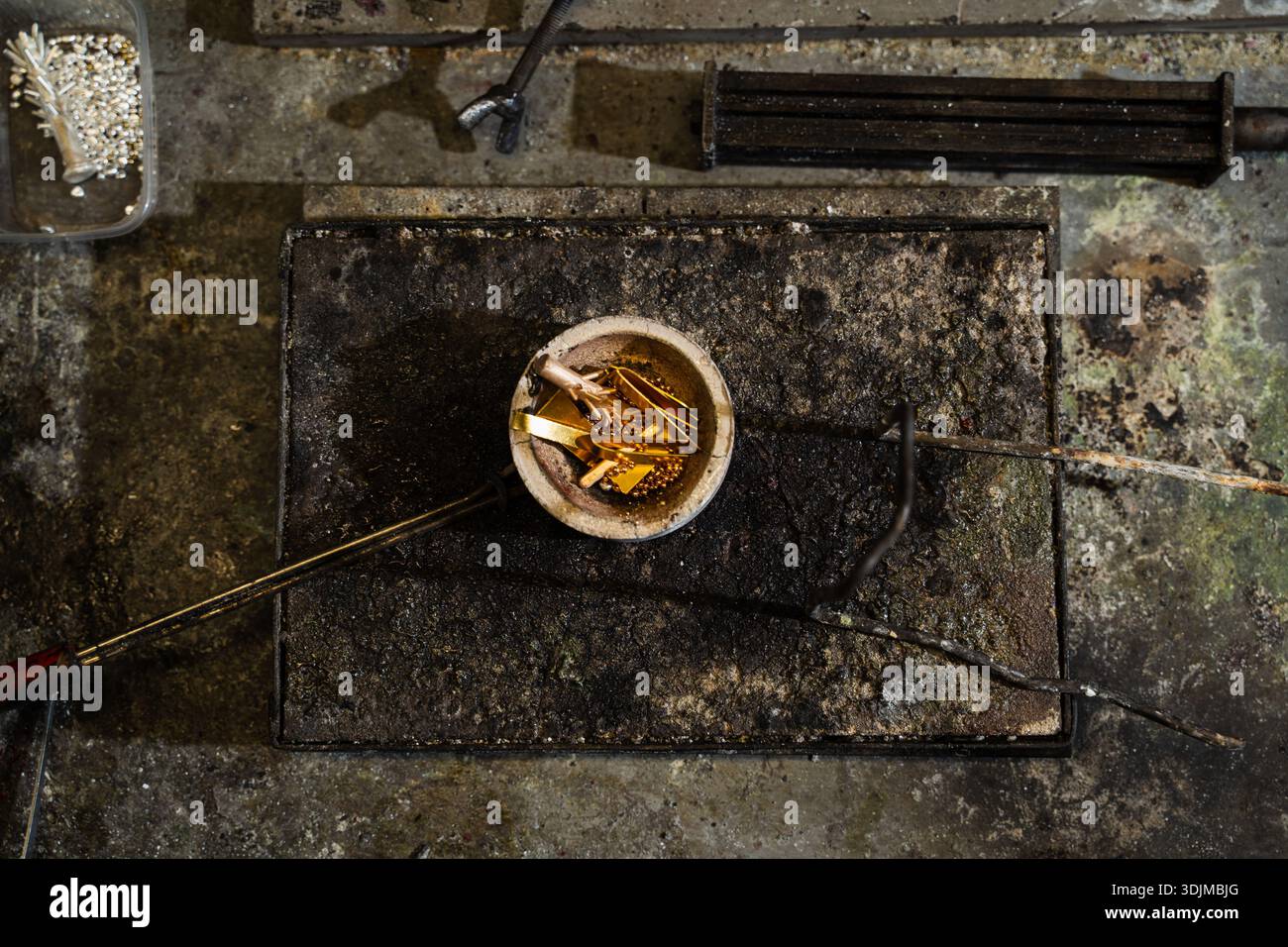 Gold and alloy materials arranged in a crucible before melting Stock ...