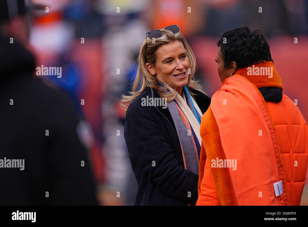 Denver Broncos co-owner Carrie Walton Penner, left, chats with fellow ...