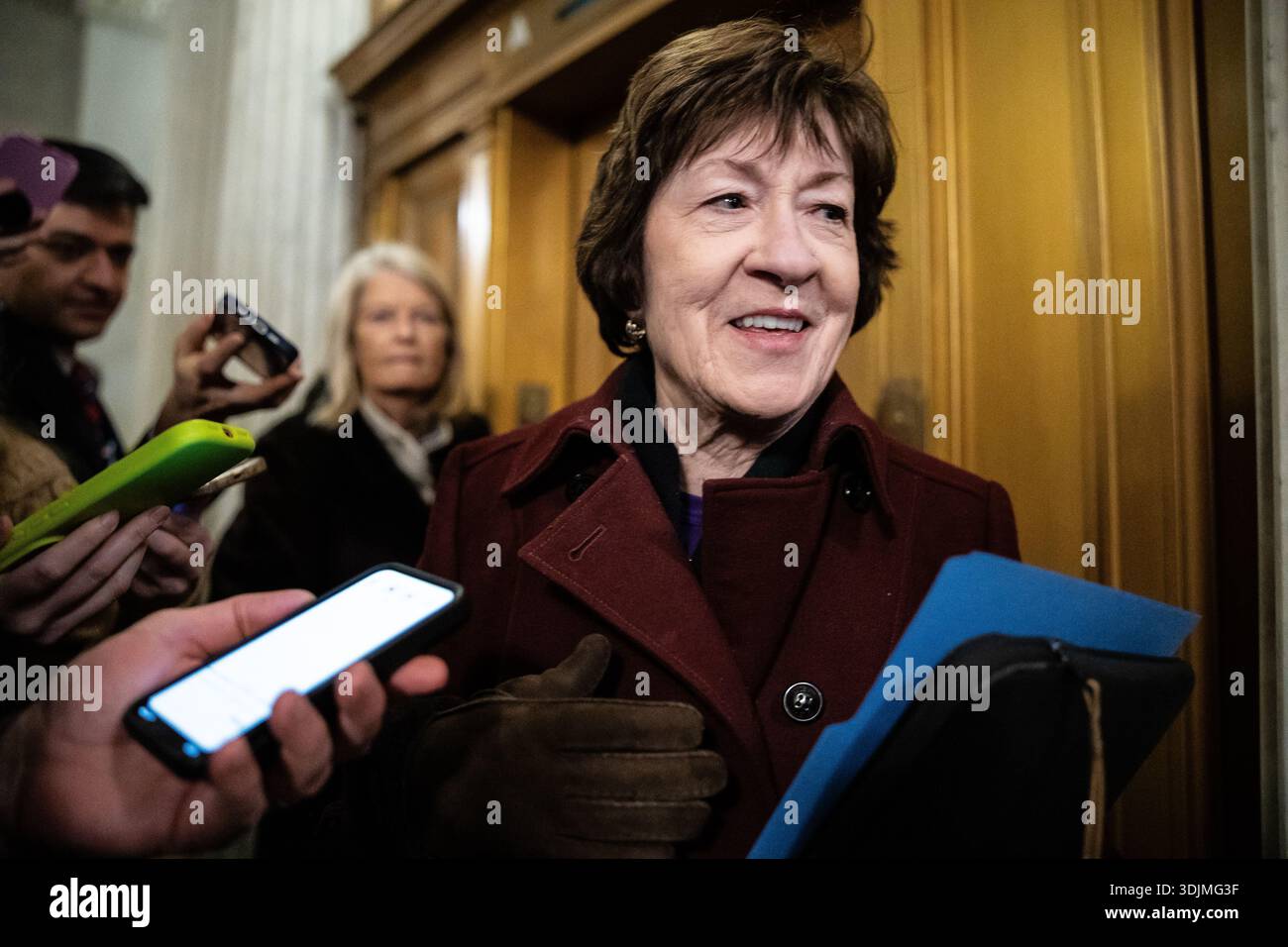 Sen. Susan Collins (R-Maine) speaks with reporters as she departs a ...