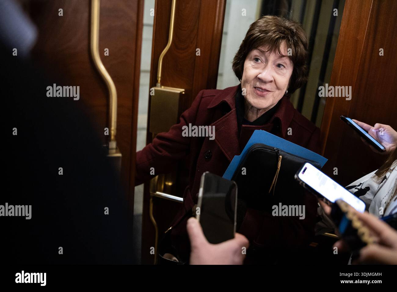 Sen. Susan Collins (R-Maine) speaks with reporters as she departs a ...