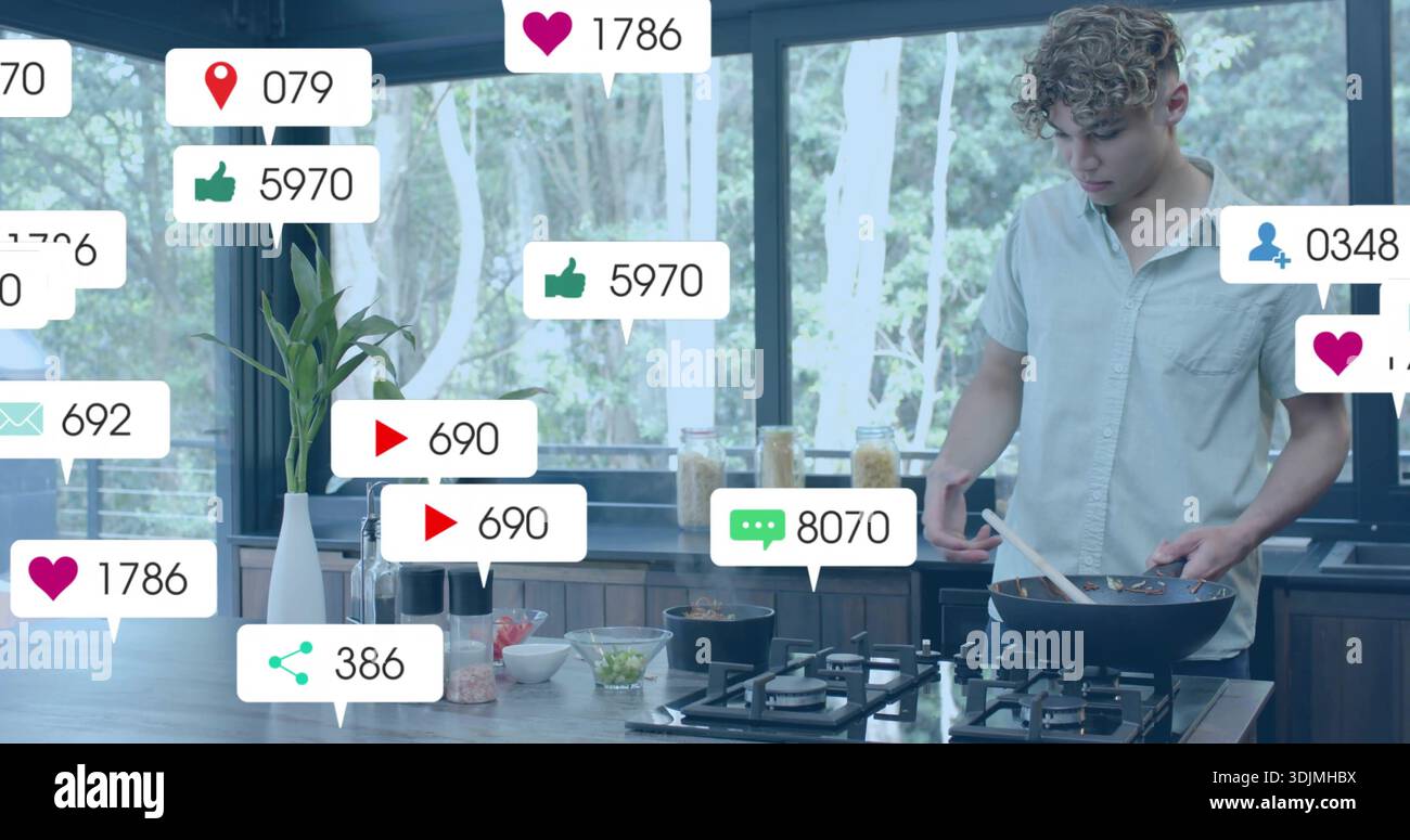 Cooking man in short-sleeves, dark-pants at kitchen-island, frying-pan ...