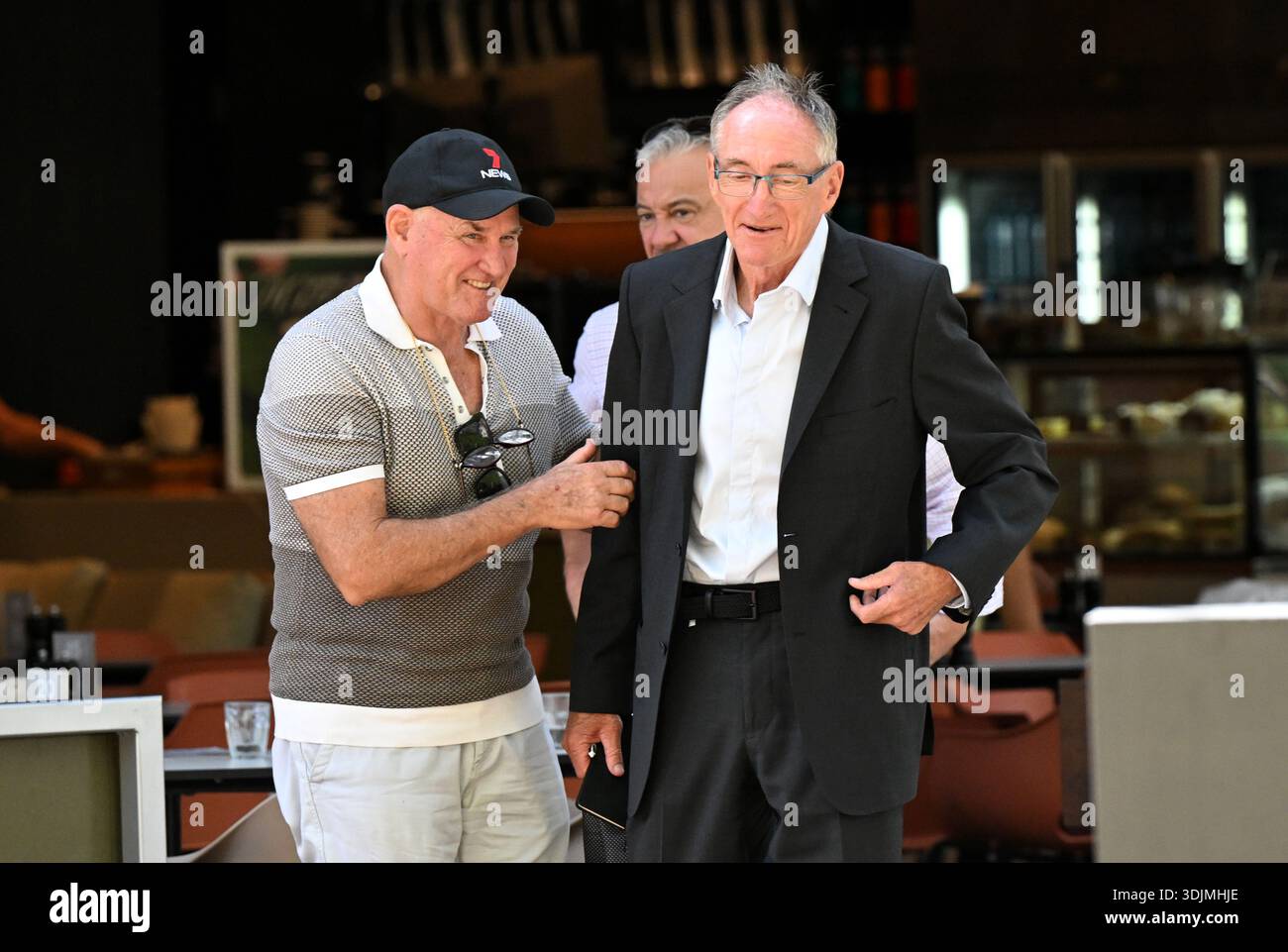 Former Sydney Roosters Rugby League captain John Tobin (right) arrives ...