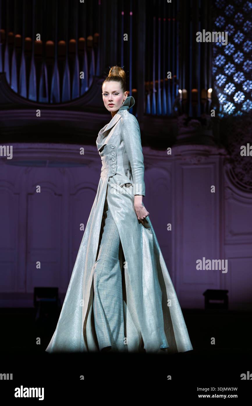 A model walks the runway during the Julien Fournié Haute Couture Week ...