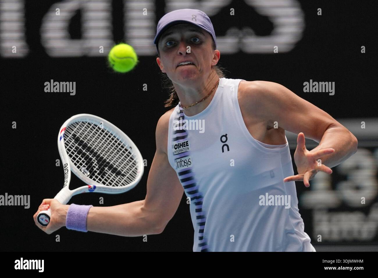 Iga Swiatek of Poland plays a forehand return to Elena Rybakina of ...