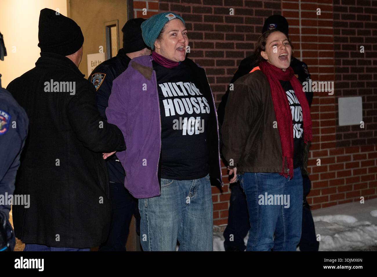 Protesters yell slogans as they are led out in handcuffs by the NYPD ...