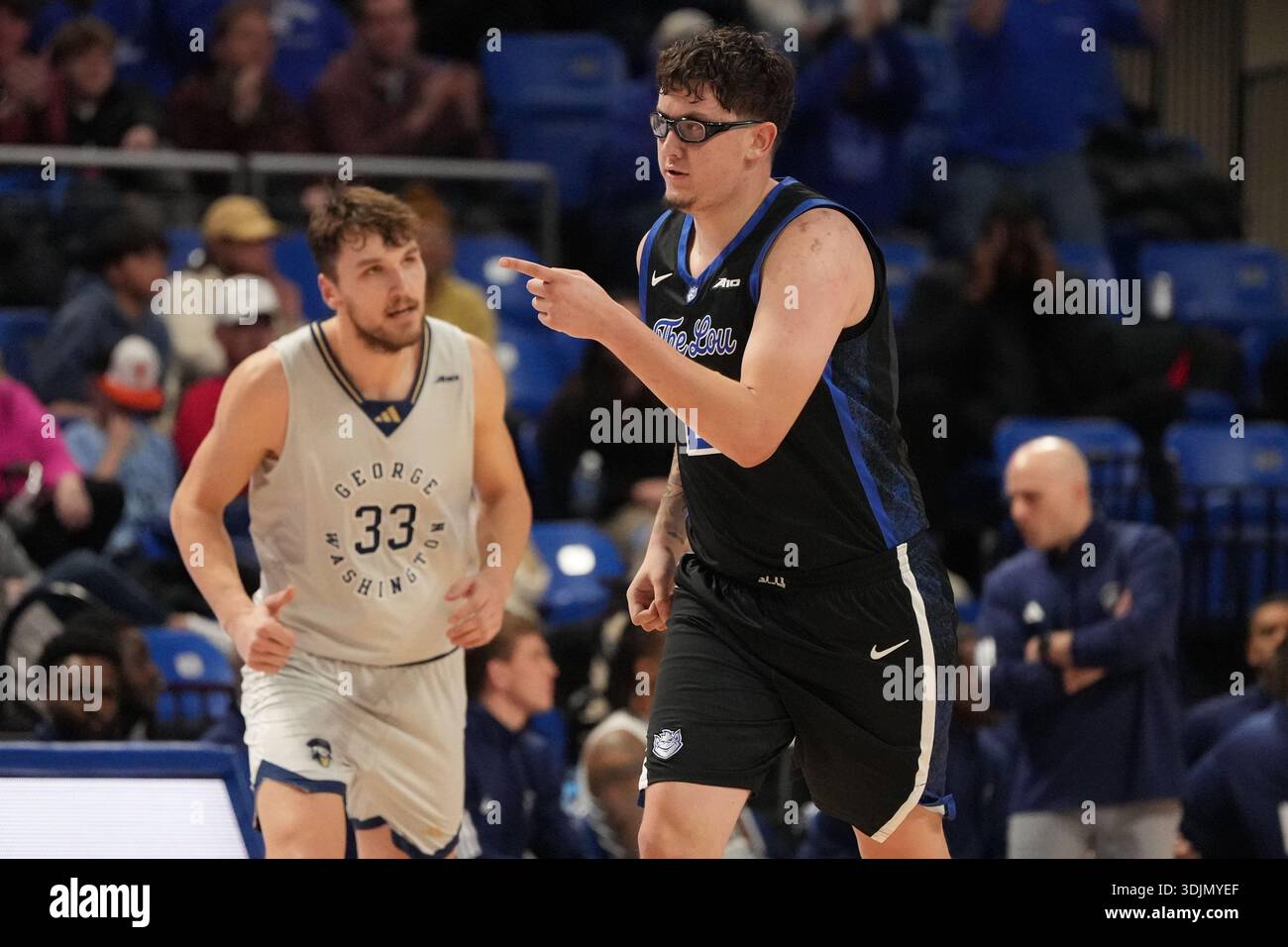 Saint Louis' Robbie Avila, right, celebrates after making a 3-point ...