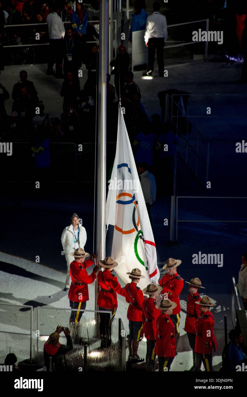 Canadian Mounties raising the Olympic Flag during medal awarding ...