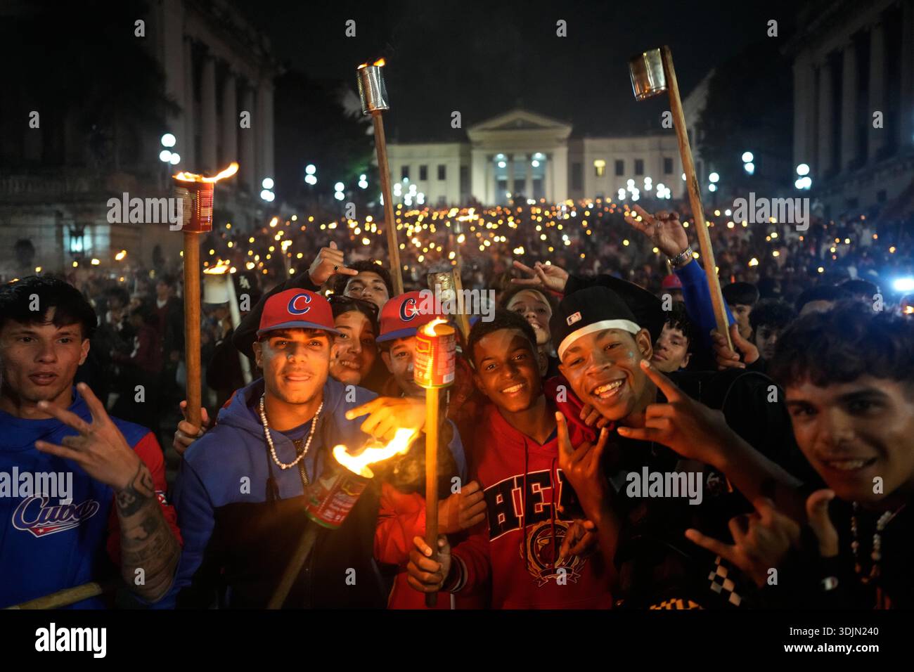 Baseball players march with torches to mark the 173rd anniversary of ...