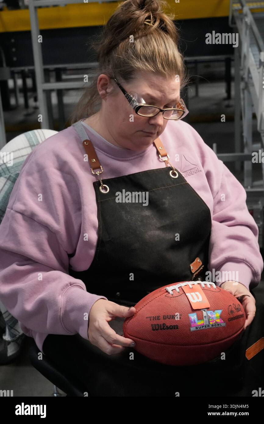 Kendra Hicks, of Kenton, Ohio, inspects finished commemorative ...