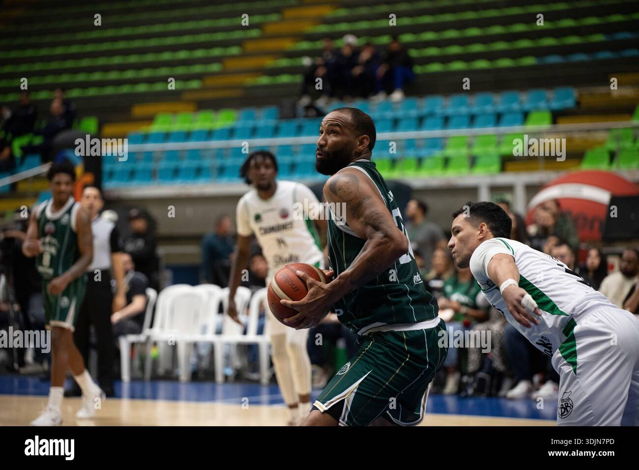 Paisas Basketball Club faces Caimanes del Llano during the group phase ...
