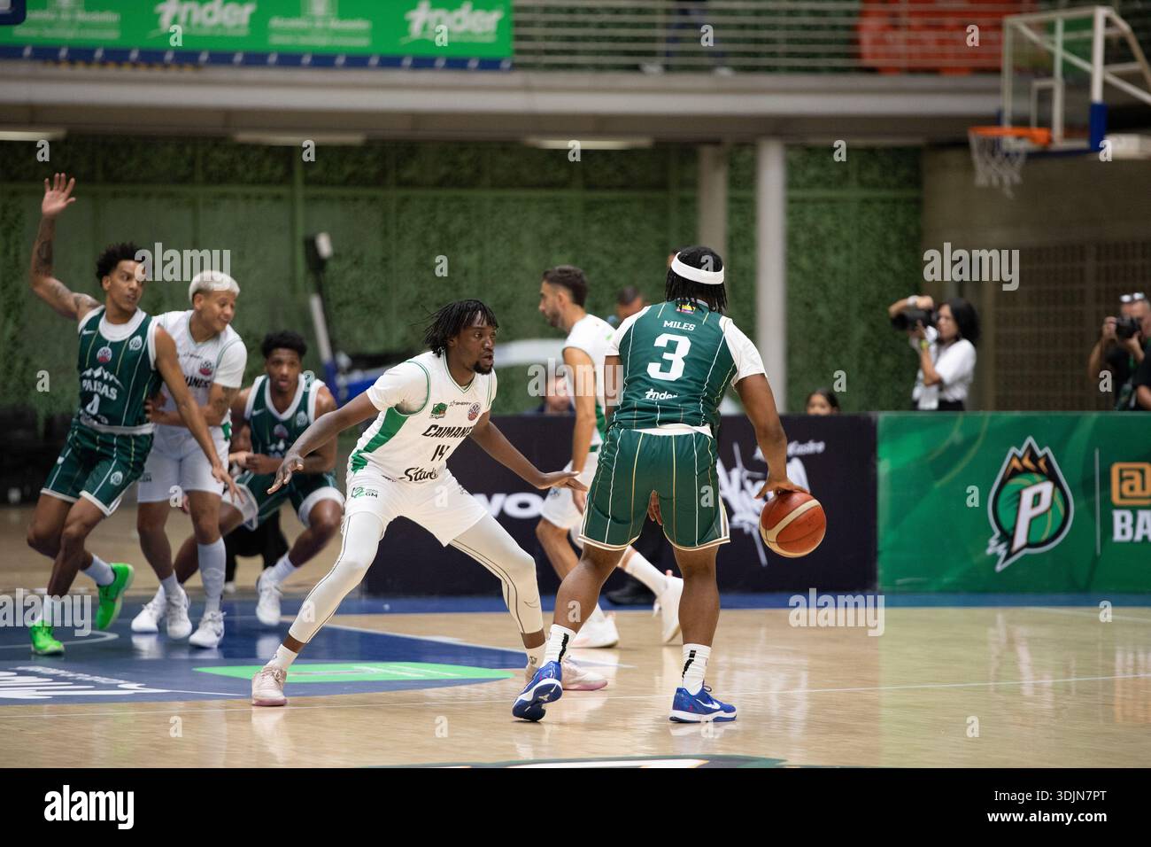 Paisas Basketball Club faces Caimanes del Llano during the group phase ...