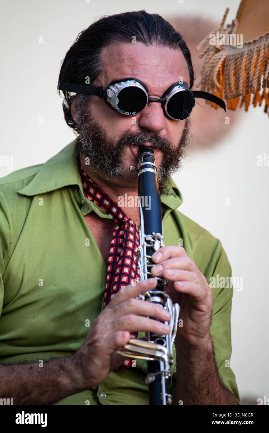 Eccentric musician wearing vintage steampunk goggles playing the ...