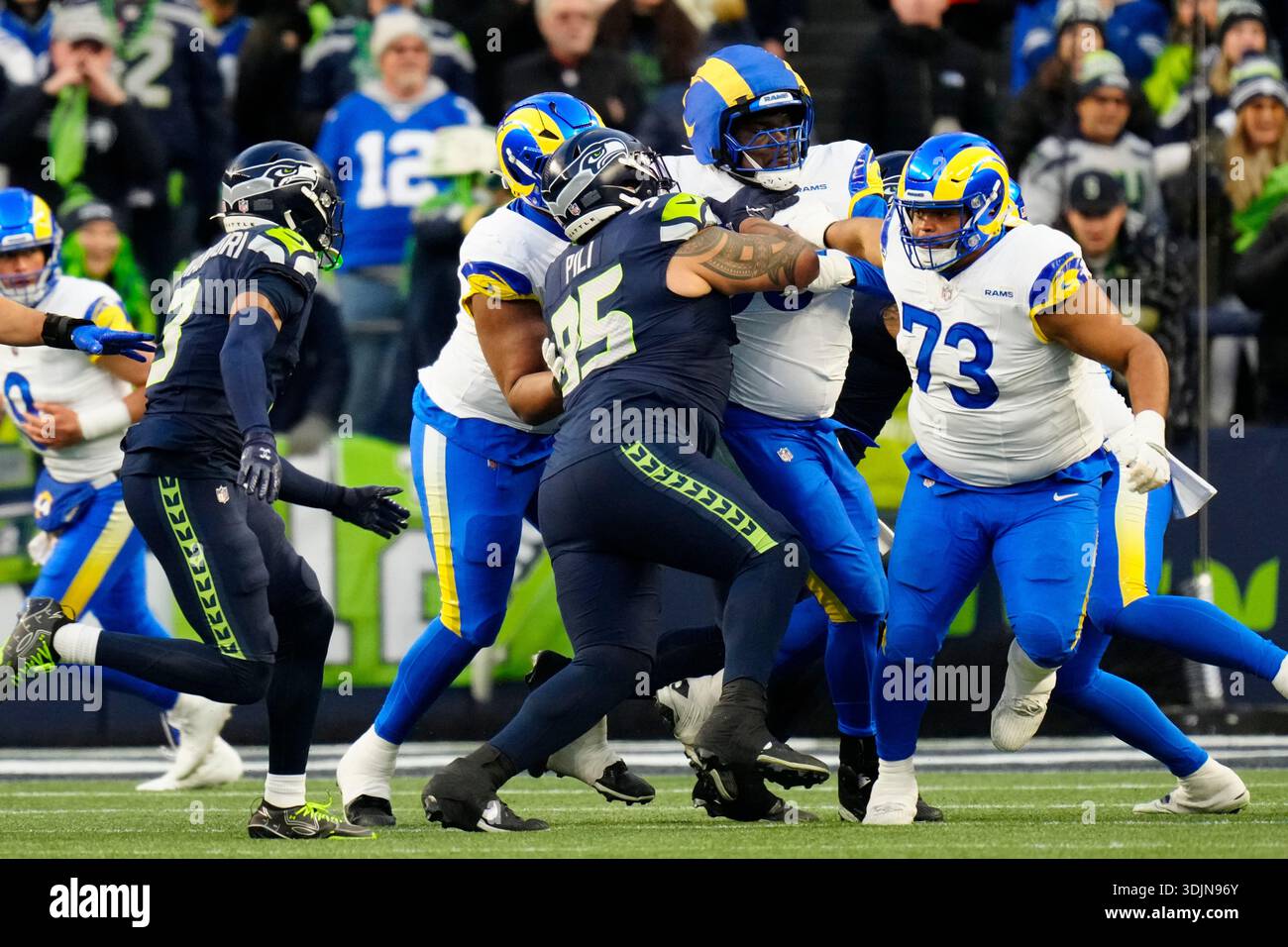 Seattle Seahawks nose tackle Brandon Pili (95) and Los Angeles Rams ...