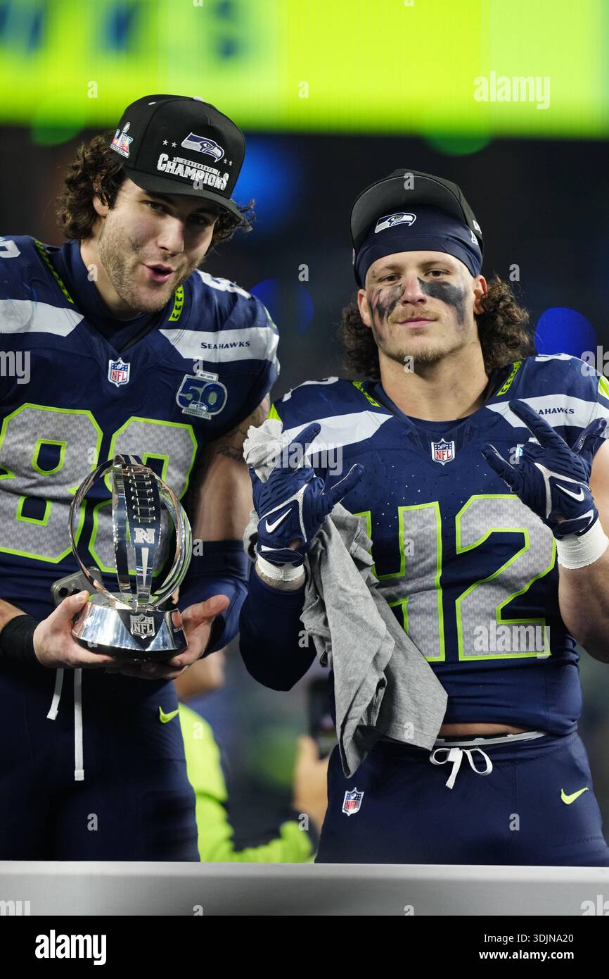 Seattle Seahawks tight end AJ Barner (88) holds the NFC Championship ...