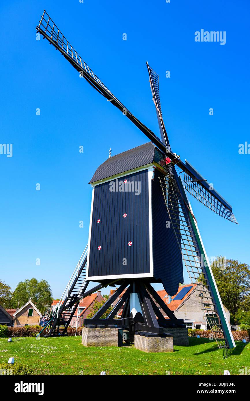 The historic 't Vliegend Hert windmill on the green ramparts of Brielle ...