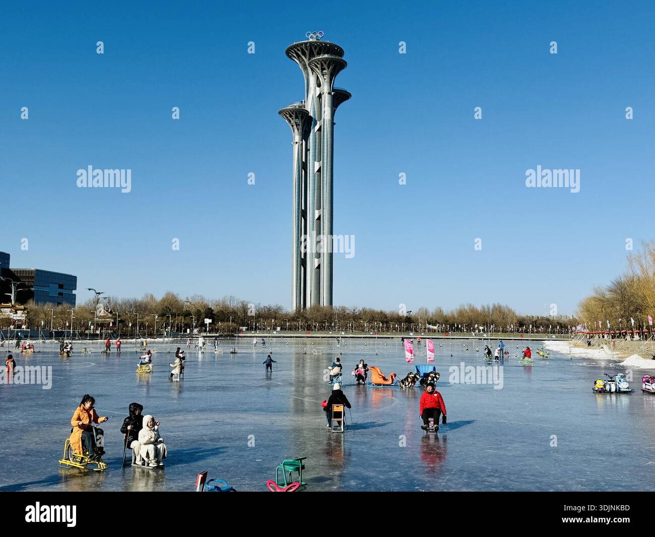 People skate on the ice rink at Beijing Olympic Park, Beijing, China ...