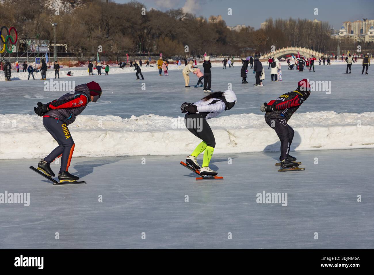 Skating enthusiasts enjoy the public ice rink at a park in Jilin City ...