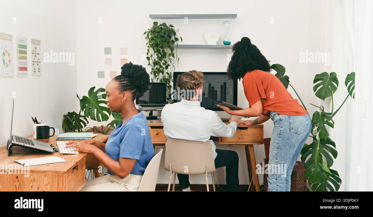 Startup team working together desks hi-res stock photography and images ...
