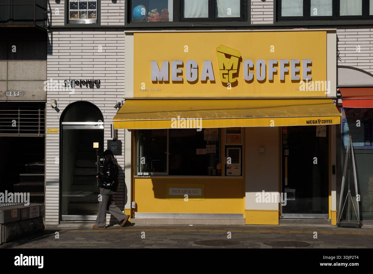 Seoul, South Korea: Mega Coffee shop exterior with bright yellow facade ...