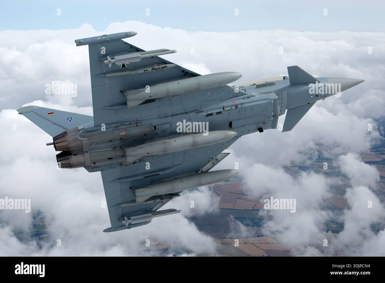 An underside air-to-air view shows a German Air Force Eurofighter EF ...