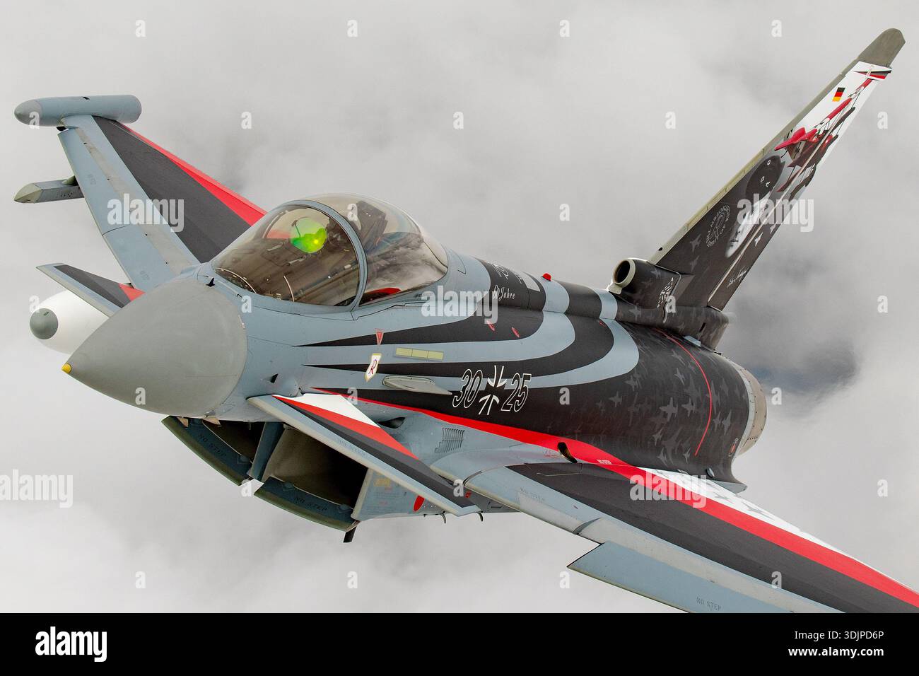 A close-up air-to-air view shows a German Air Force Eurofighter EF-2000 ...