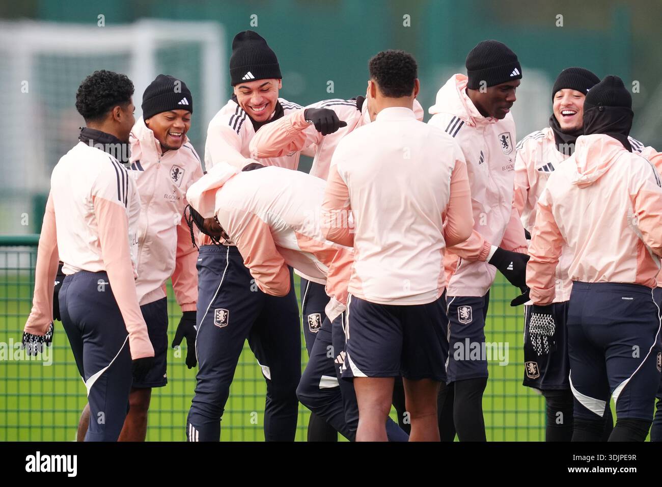 Aston Villa's Tammy Abraham (centre left) is embraced by Morgan Rogers ...