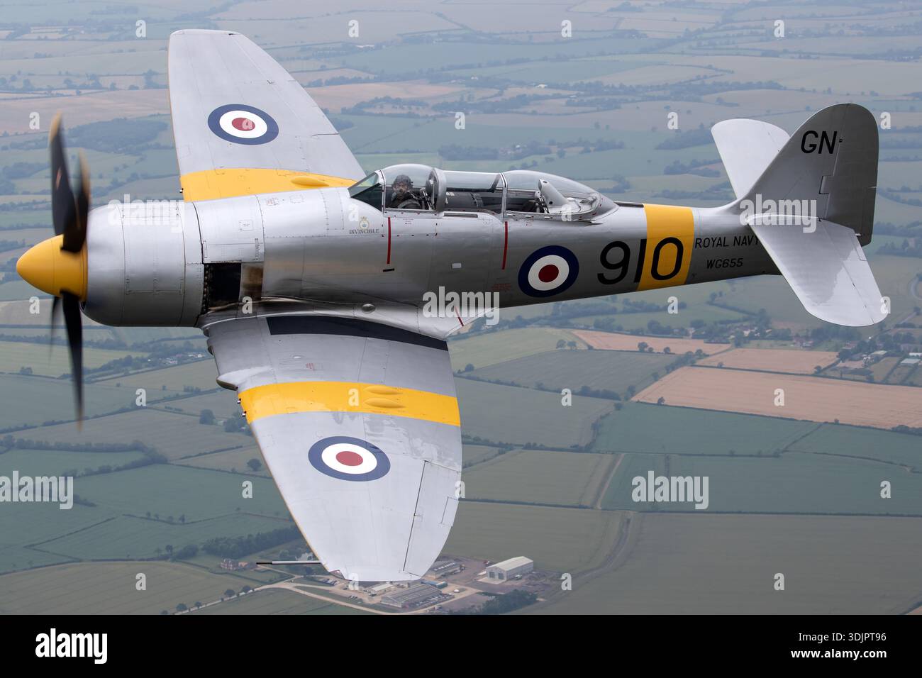 This air‑to‑air view from UK Warbirds 2019 shows a Hawker Sea Fury T20 ...