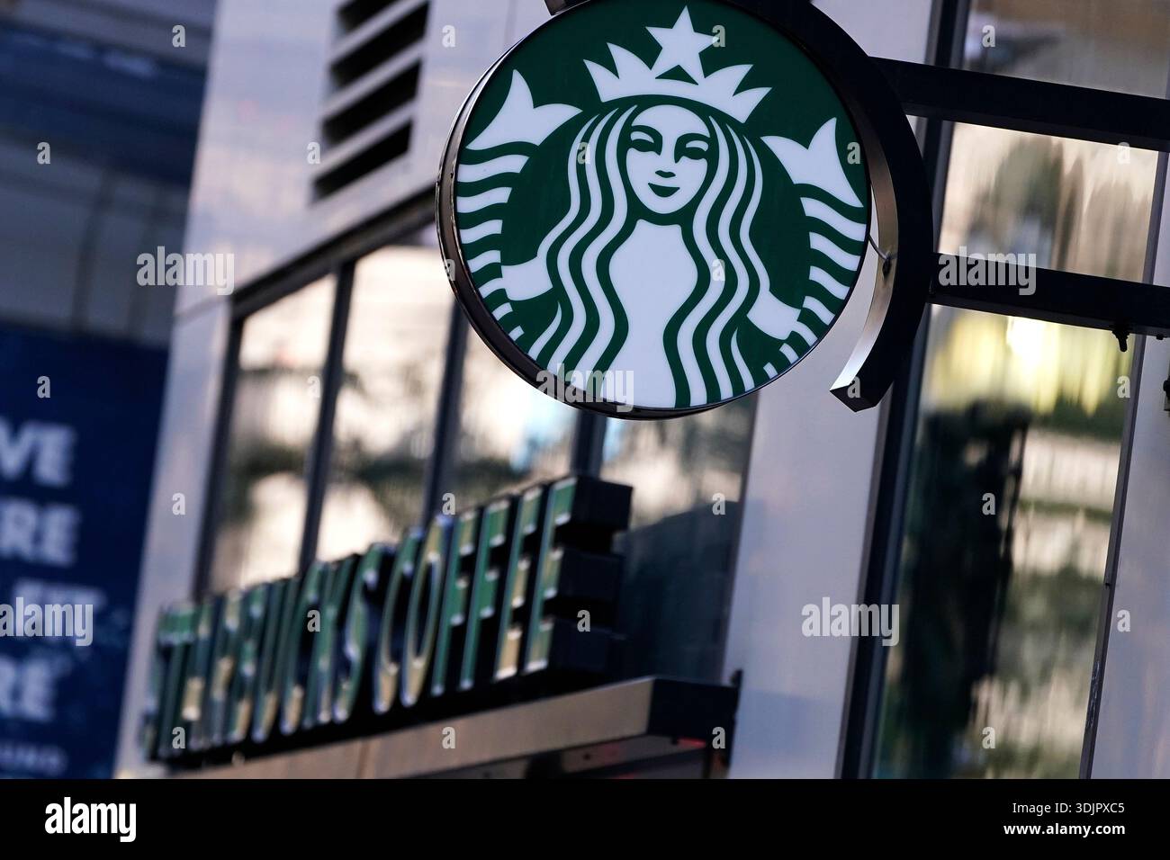 FILE - The "Siren" logo hangs outside a Starbucks Coffee shop ...