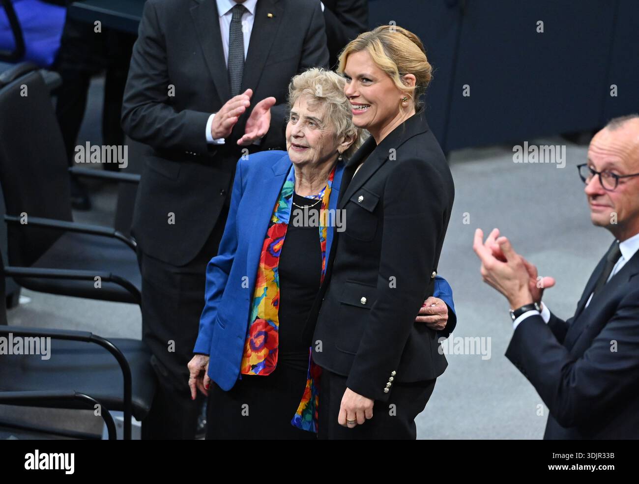 28 January 2026, Berlin: Tova Friedman (l), Holocaust survivor, looks ...