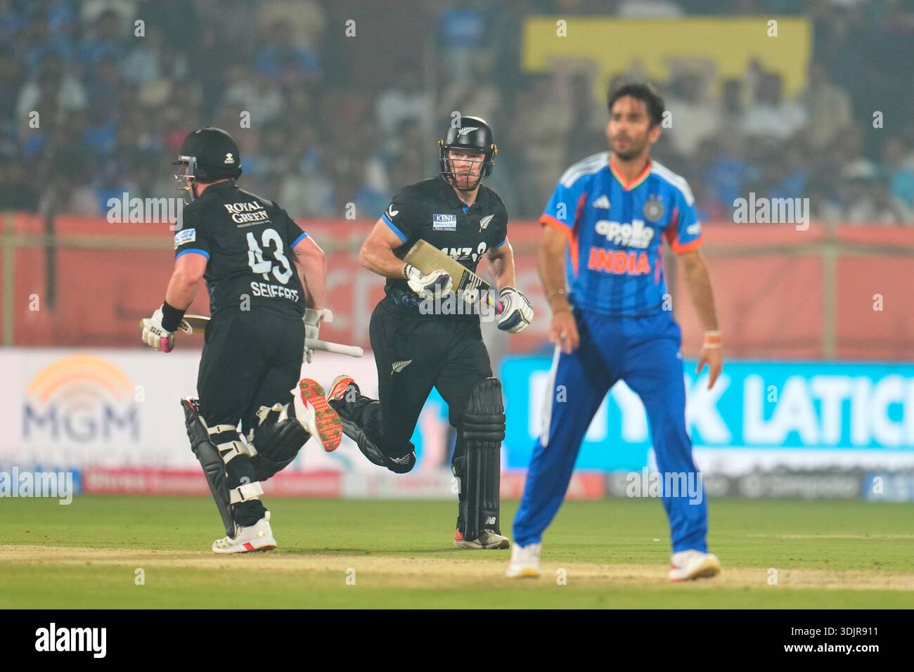 New Zealand's Tim Seifert and Glenn Phillips run between the wickets to ...