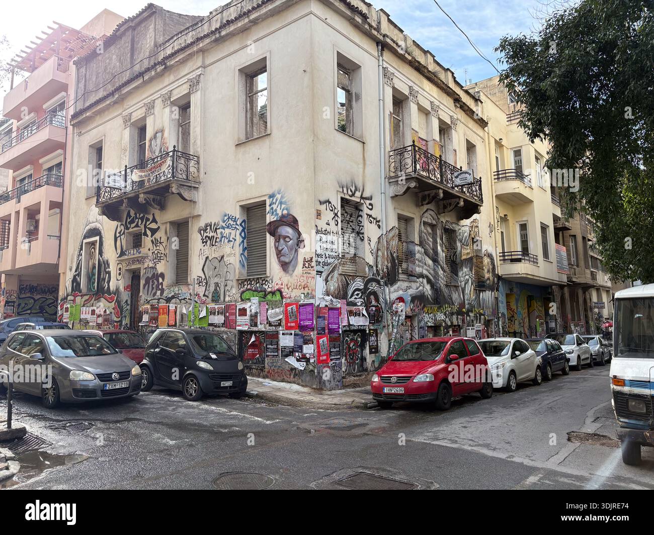 Urban street corner in Athens, Greece, featuring a heavily tagged ...
